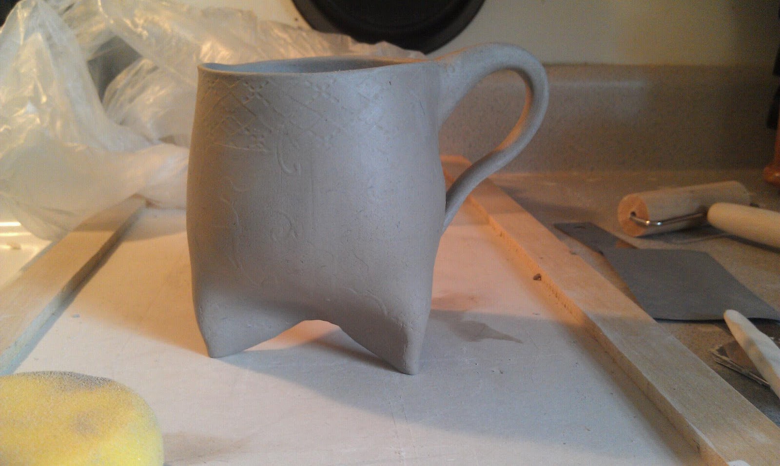 Earth Skin Pottery: Cute pudgy tripod mug